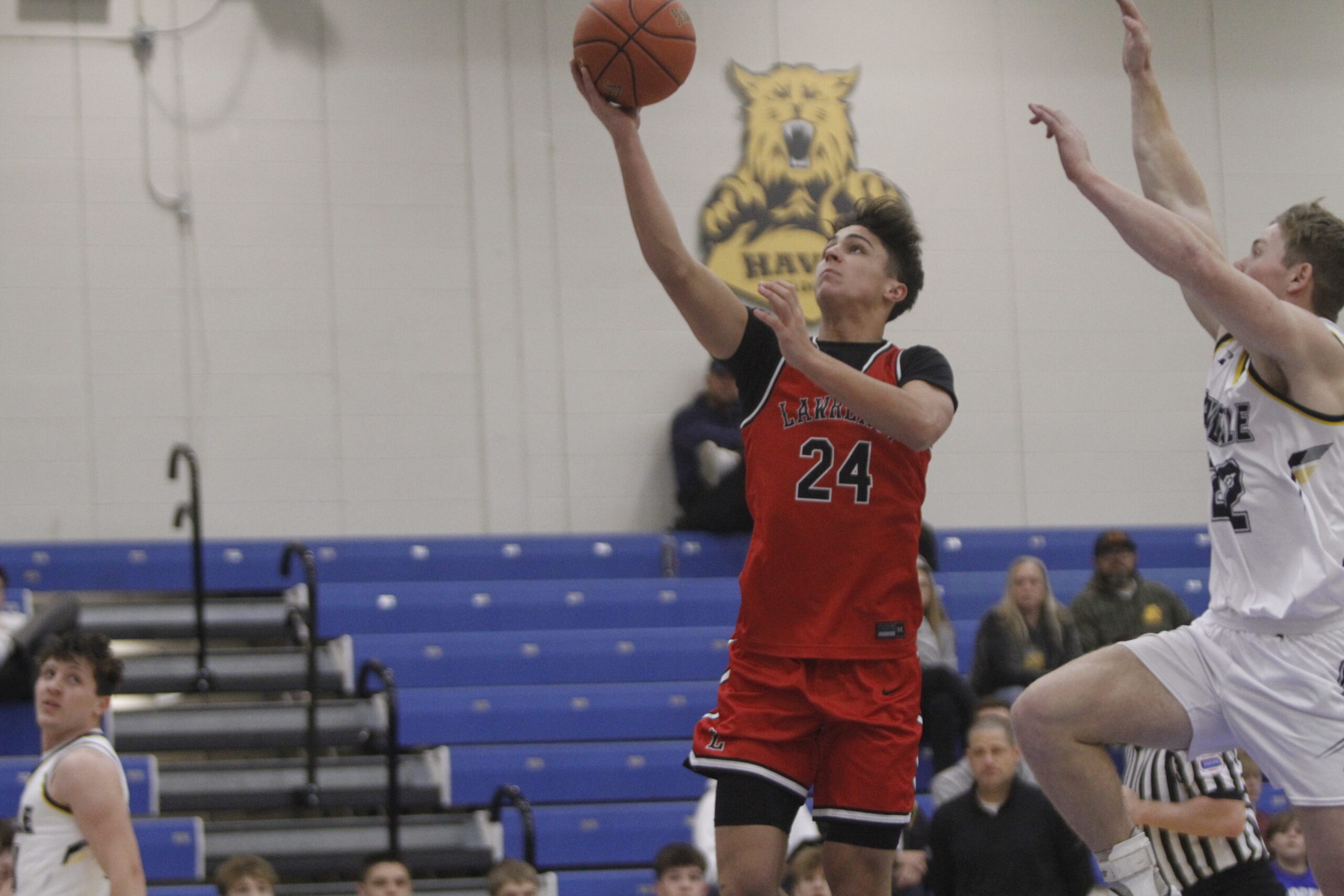 Inconsistent play costs Lawrence boys basketball in 75-56 loss to ...